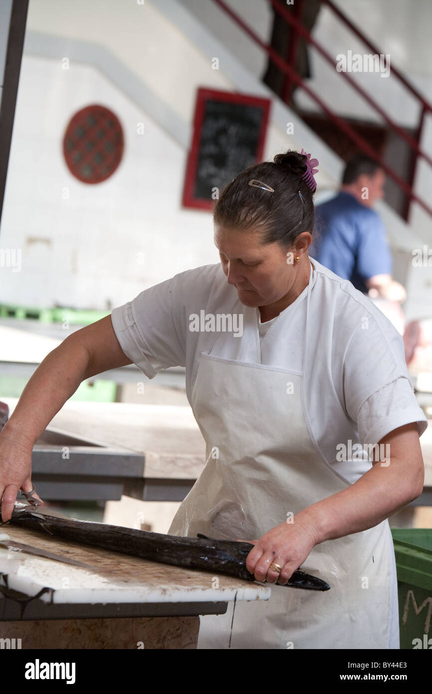Woman fishmonger preparing fish at Funchal fish market Madeira Stock ...