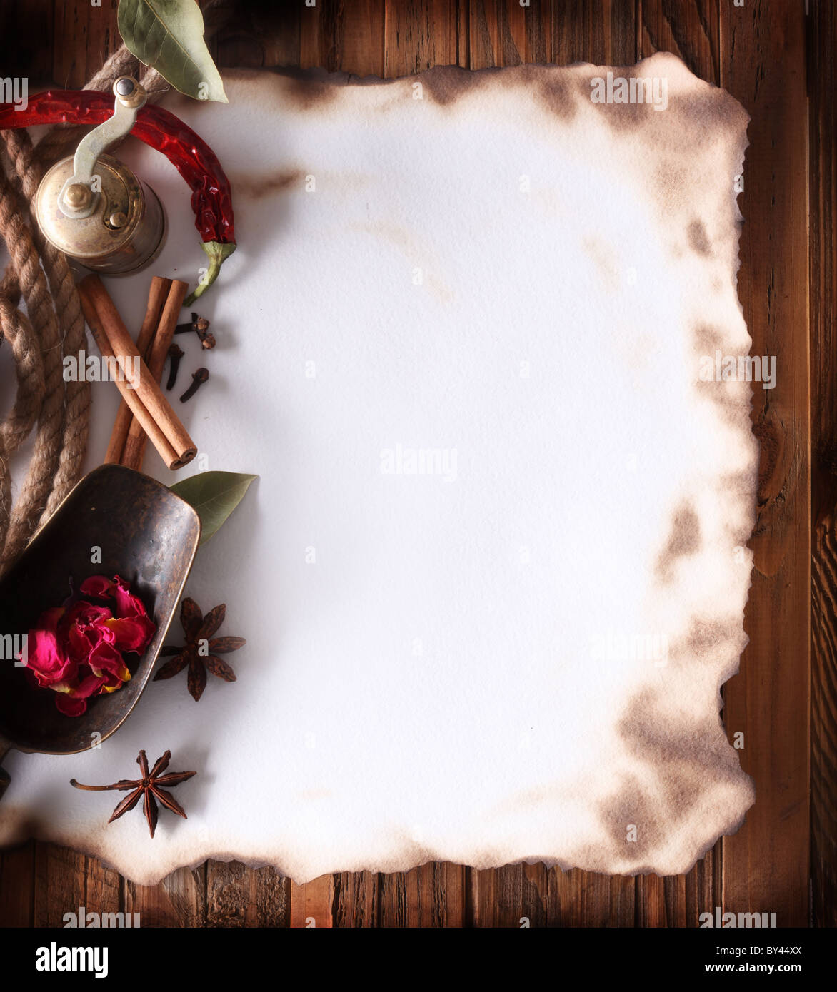 Image of old paper with spices on a wooden surface Stock Photo - Alamy
