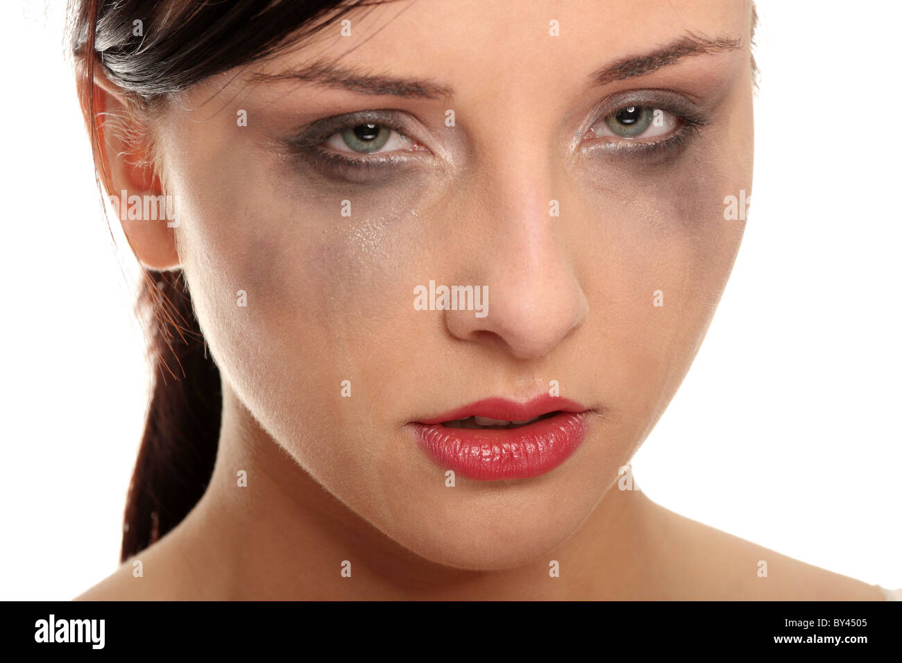 Abused young woman over white background Stock Photo - Alamy