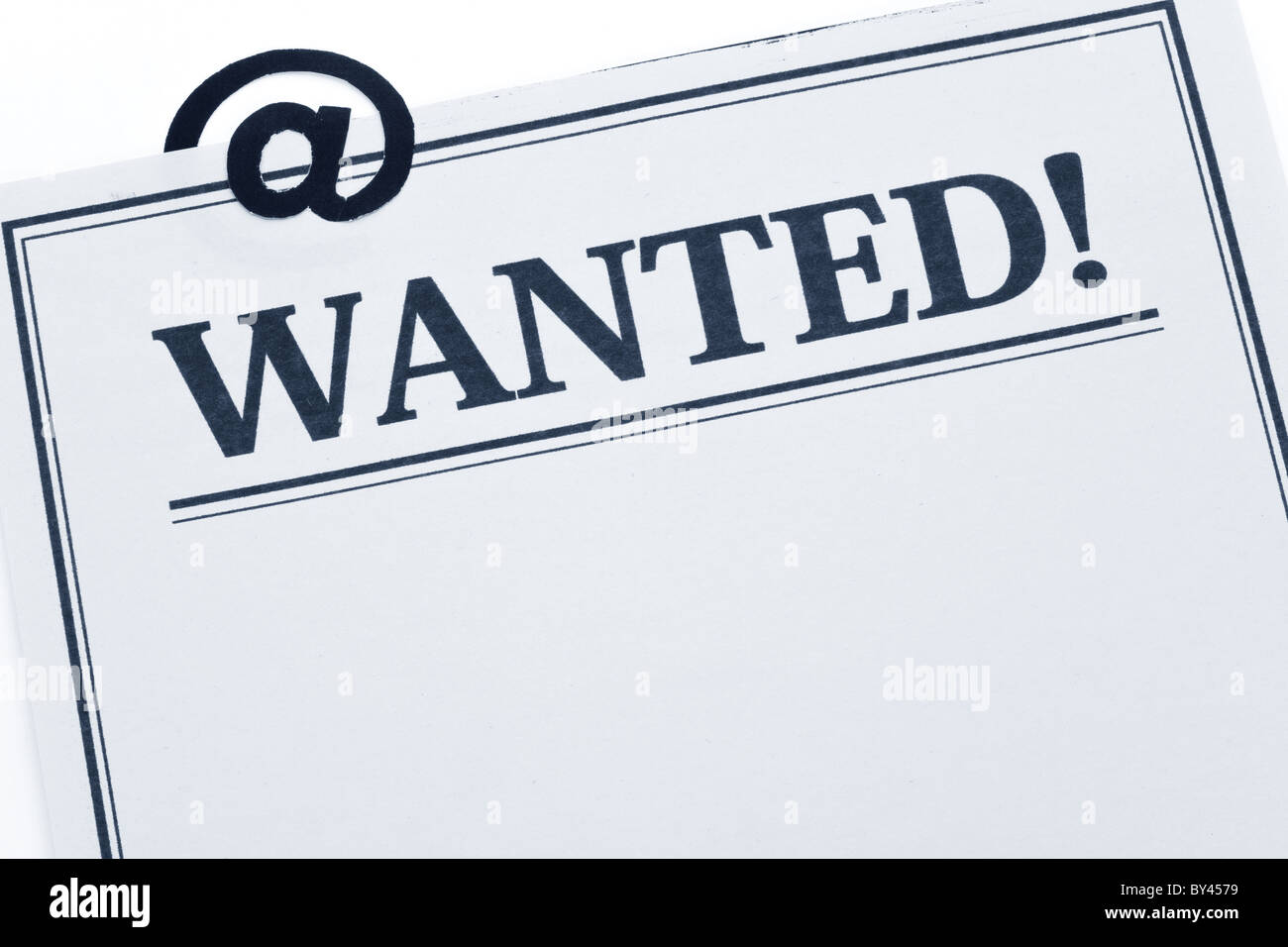 Wanted Poster and at sign, concept of Wanted online Stock Photo - Alamy