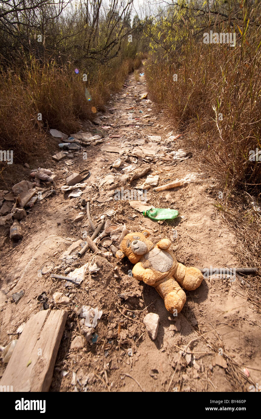 Trash-strewn path from the Rio Grande River, the border between the ...