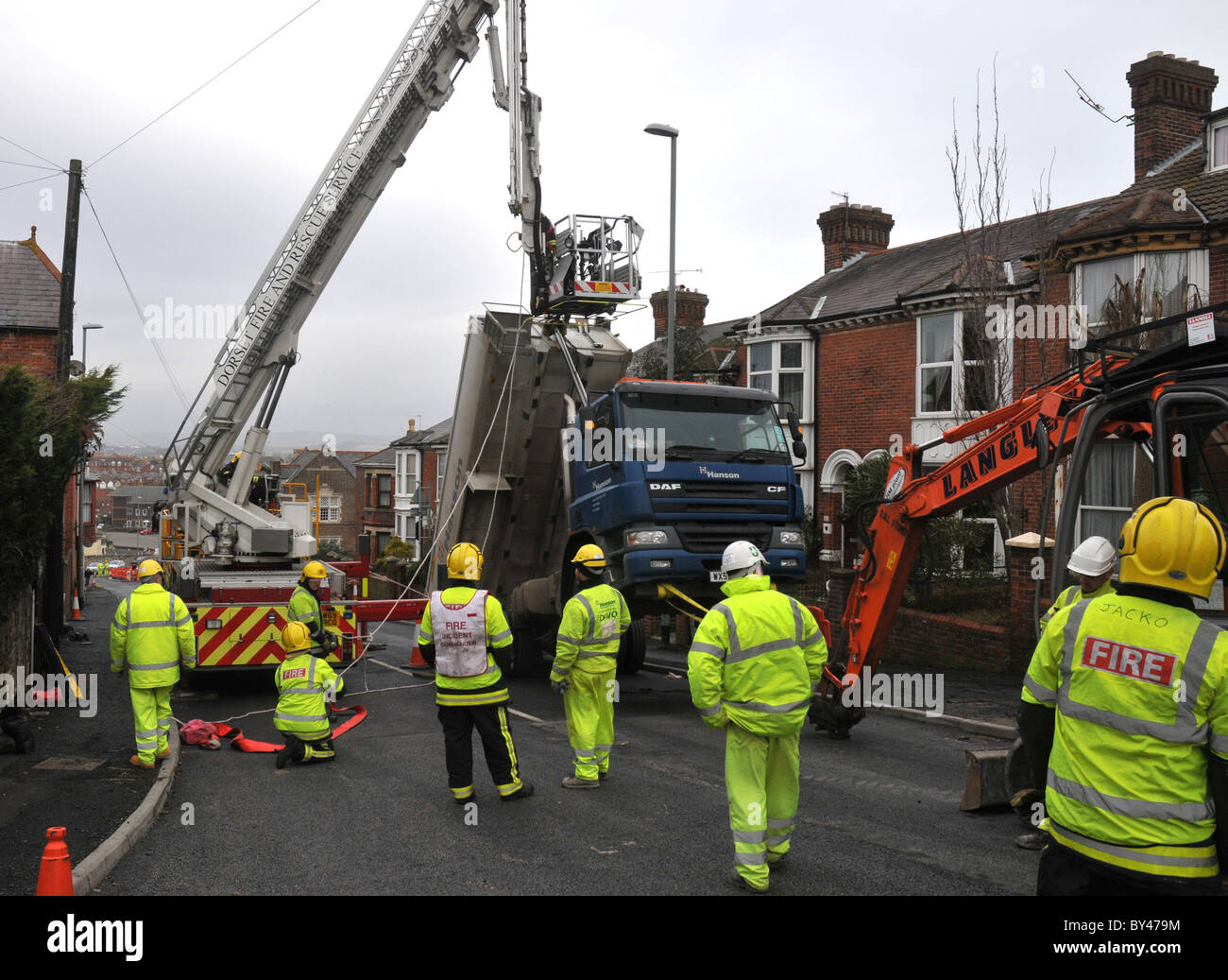 UK, Dorset, Lucky escape for road workers when a 23-tonne lorry almost ...