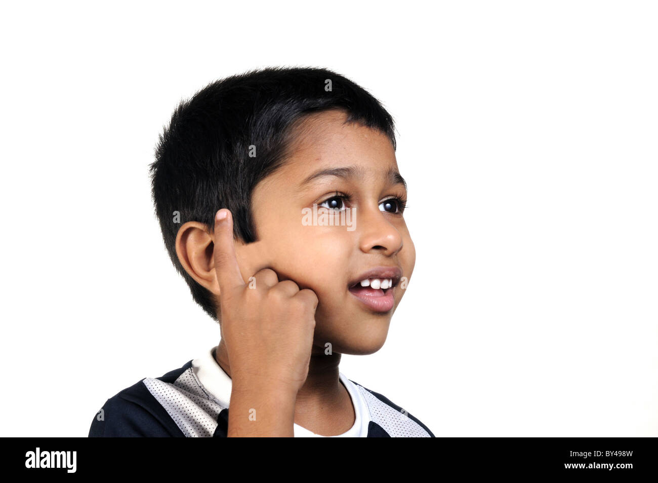 an handsome young indian kid thinking about something Stock Photo - Alamy