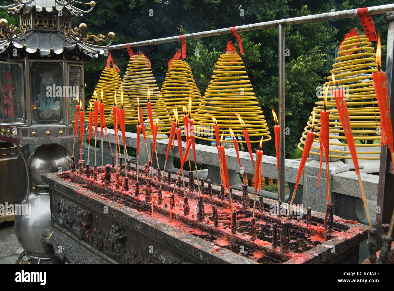 Candles and incenses were lit to worship holy gods in a Chinese temple ...