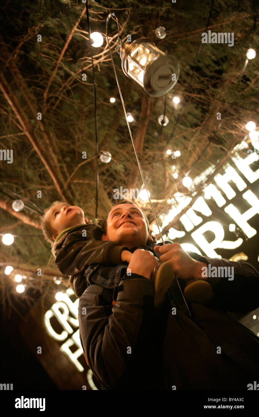 Father and child at Lantern Procession in Cardiff Bay at Christmas ...