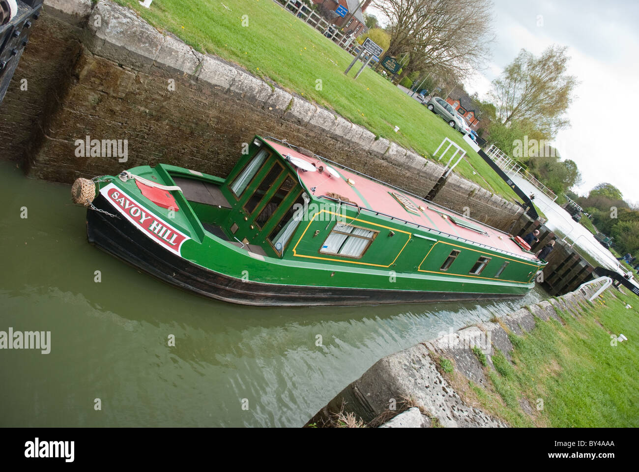 A narrow boat in a lock on the Avon canal in Devizes, Somerset, in west ...