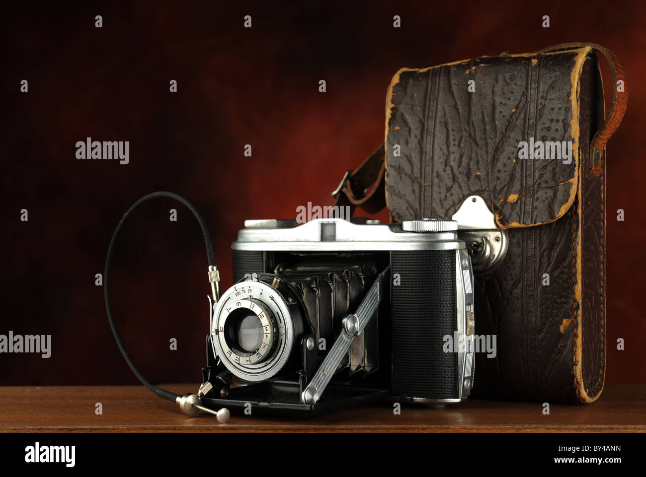 Old camera set over brown background Stock Photo - Alamy