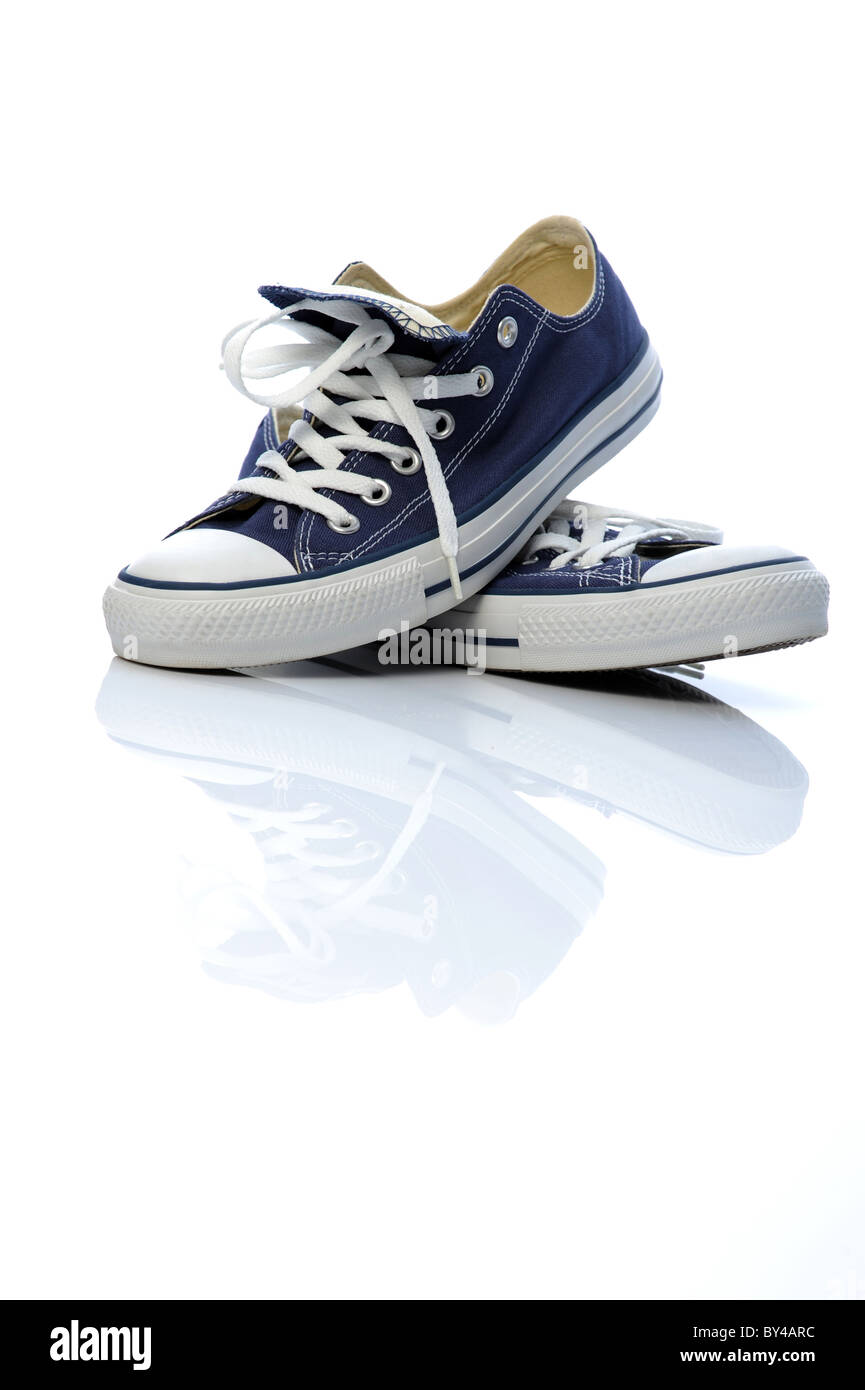 Blue sneakers with a reflection isolated on white Stock Photo - Alamy