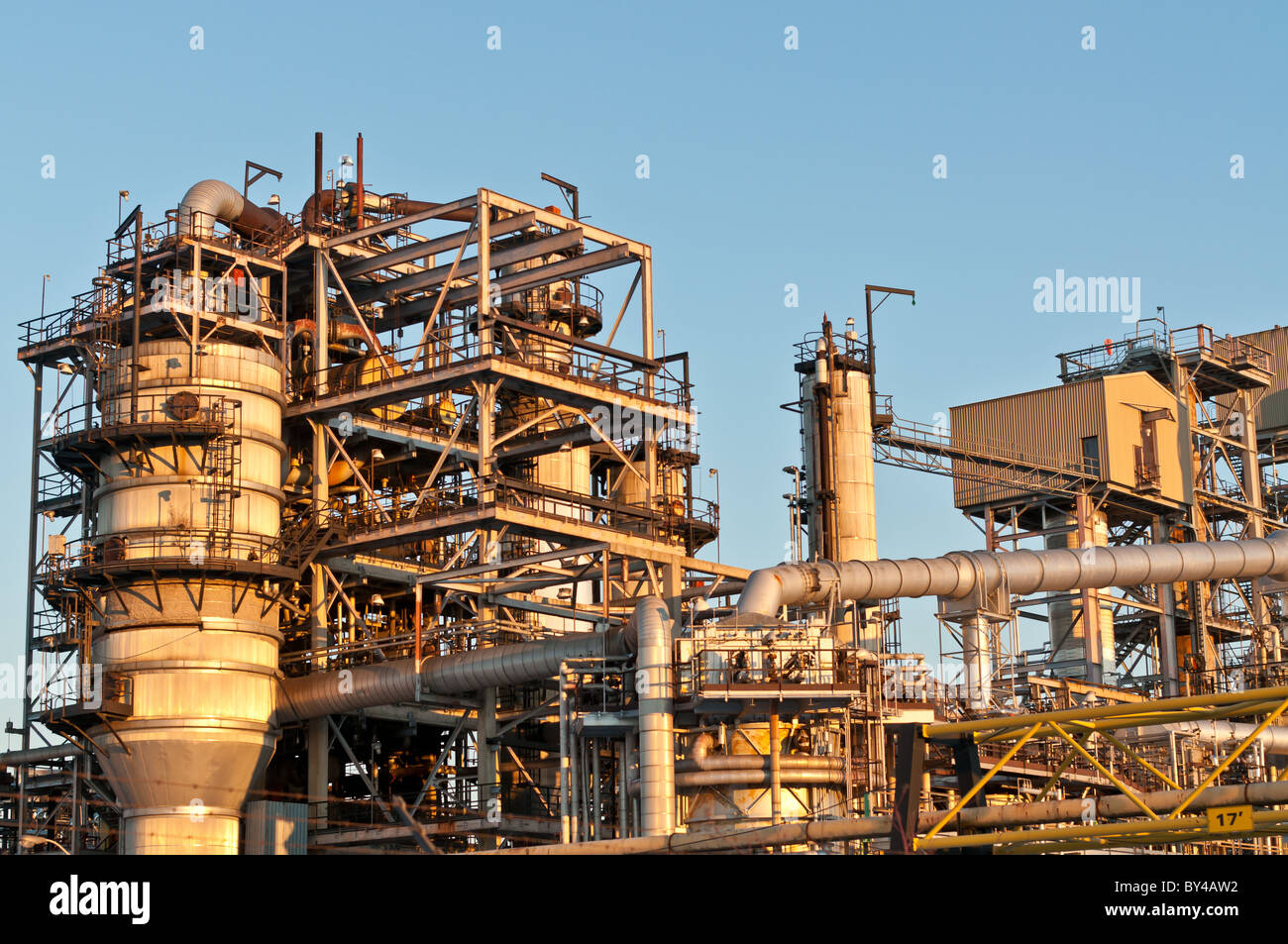 A petrochemical refinery plant with pipes and cooling towers Stock ...