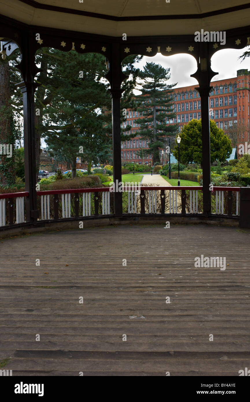 Belper's famous East Mill seen through the arches of the bandstand in ...