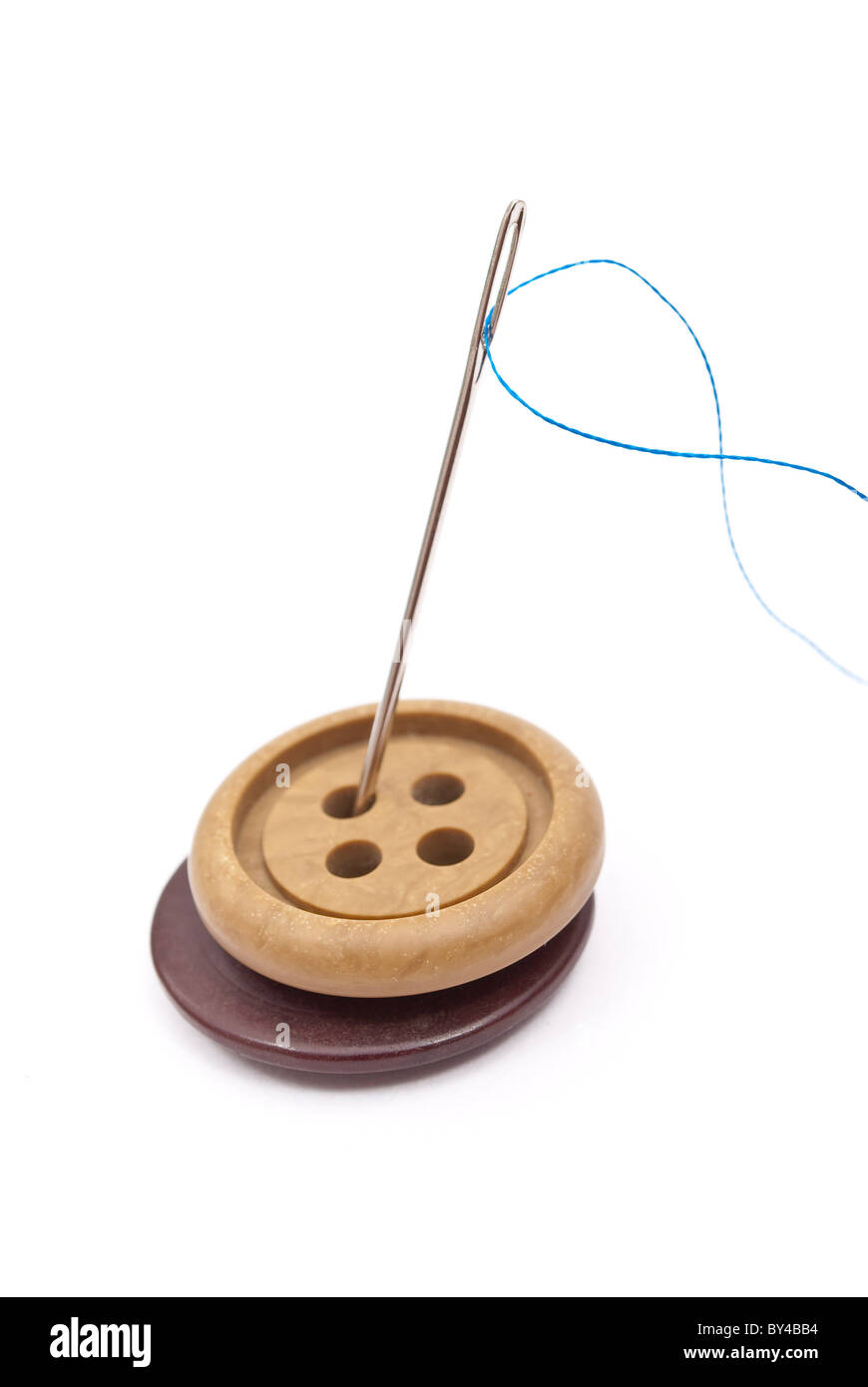 Buttons with needle Stock Photo - Alamy