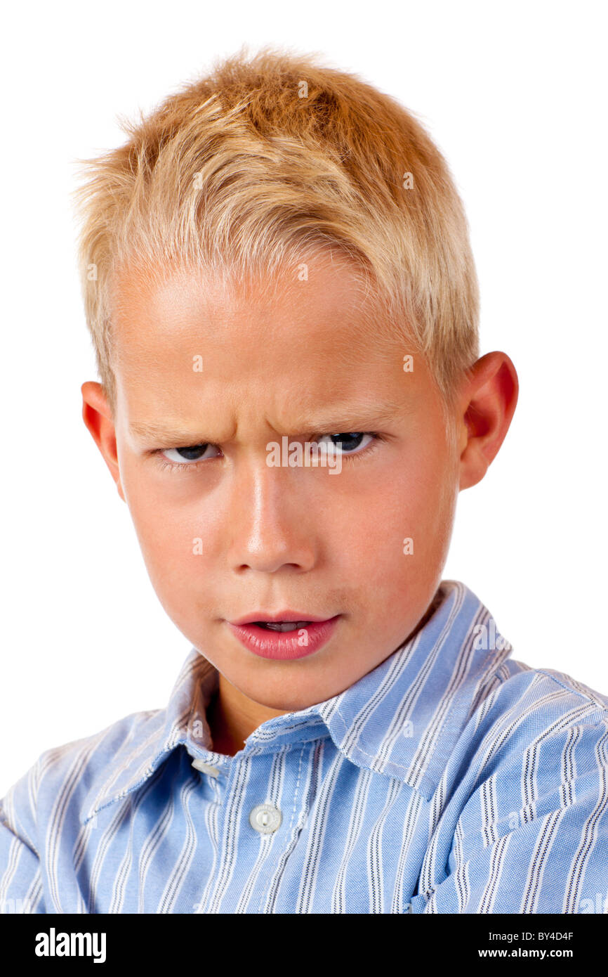 Portrait of grim boy looking at camera. Isolated on white background ...