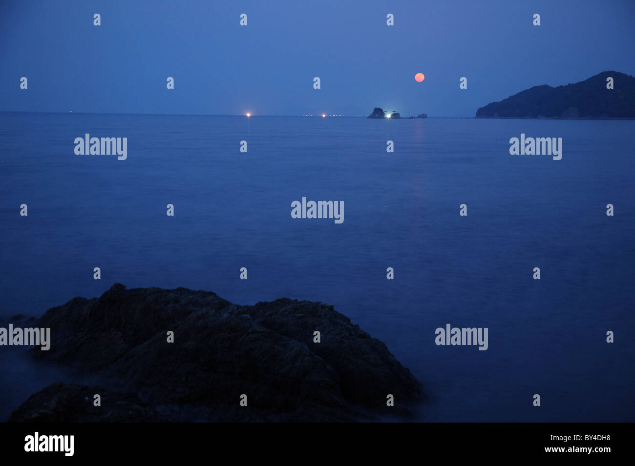 Ocean and moon Stock Photo - Alamy