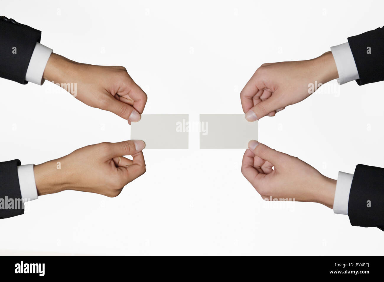 Two businessmen exchanging business card hi-res stock photography and ...