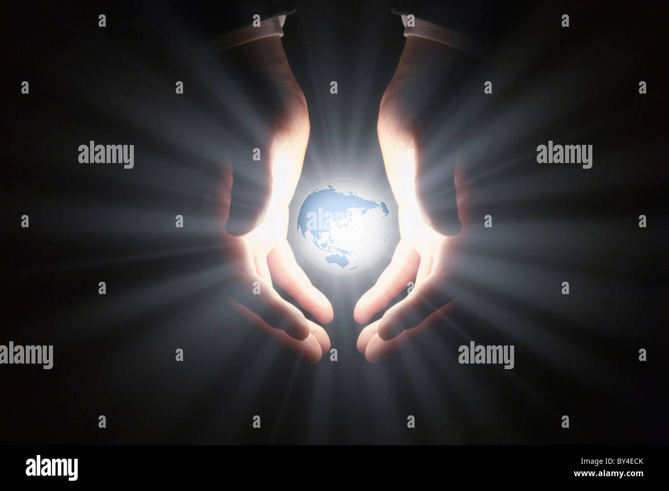 Globe floating in businessman's hands Stock Photo - Alamy