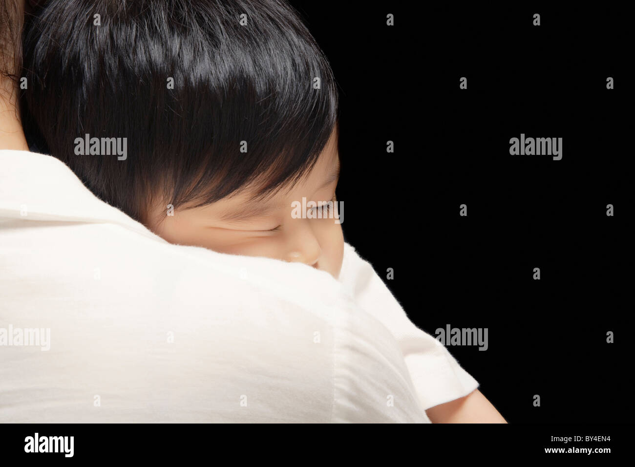 Mother carrying baby Stock Photo - Alamy
