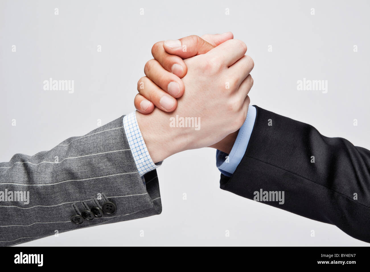 Businessmen shaking hands Stock Photo - Alamy