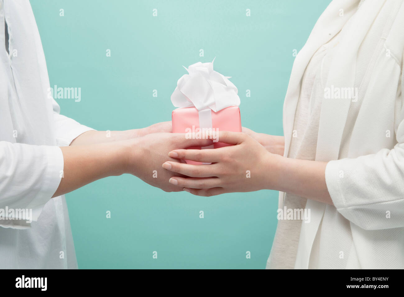 Hands holding a gift Stock Photo - Alamy