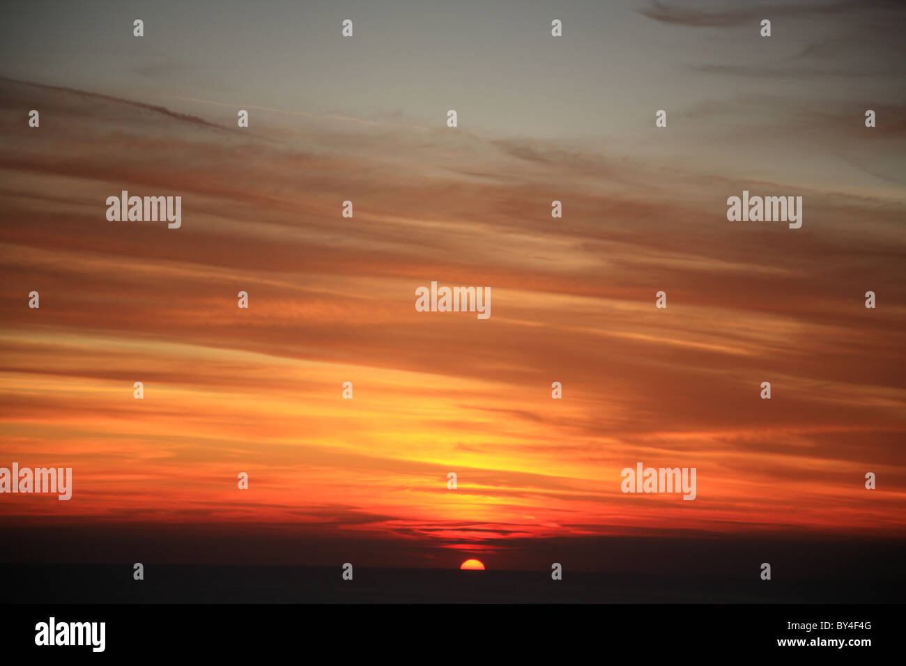 Sun setting down into the horizon England, UK Stock Photo - Alamy
