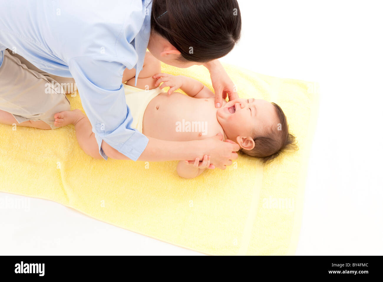 Mother Tickling Baby Boy Stock Photo - Alamy