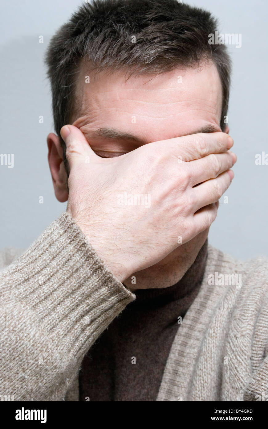 man hiding his face Stock Photo - Alamy