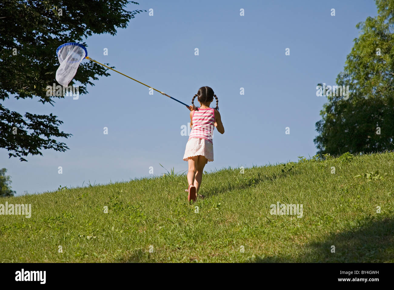 Girl Catching Butterflies Stock Photo - Alamy