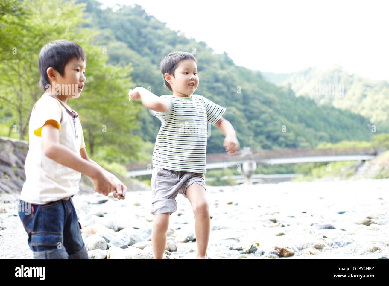 Two Boys Playing in Water Stock Photo - Alamy