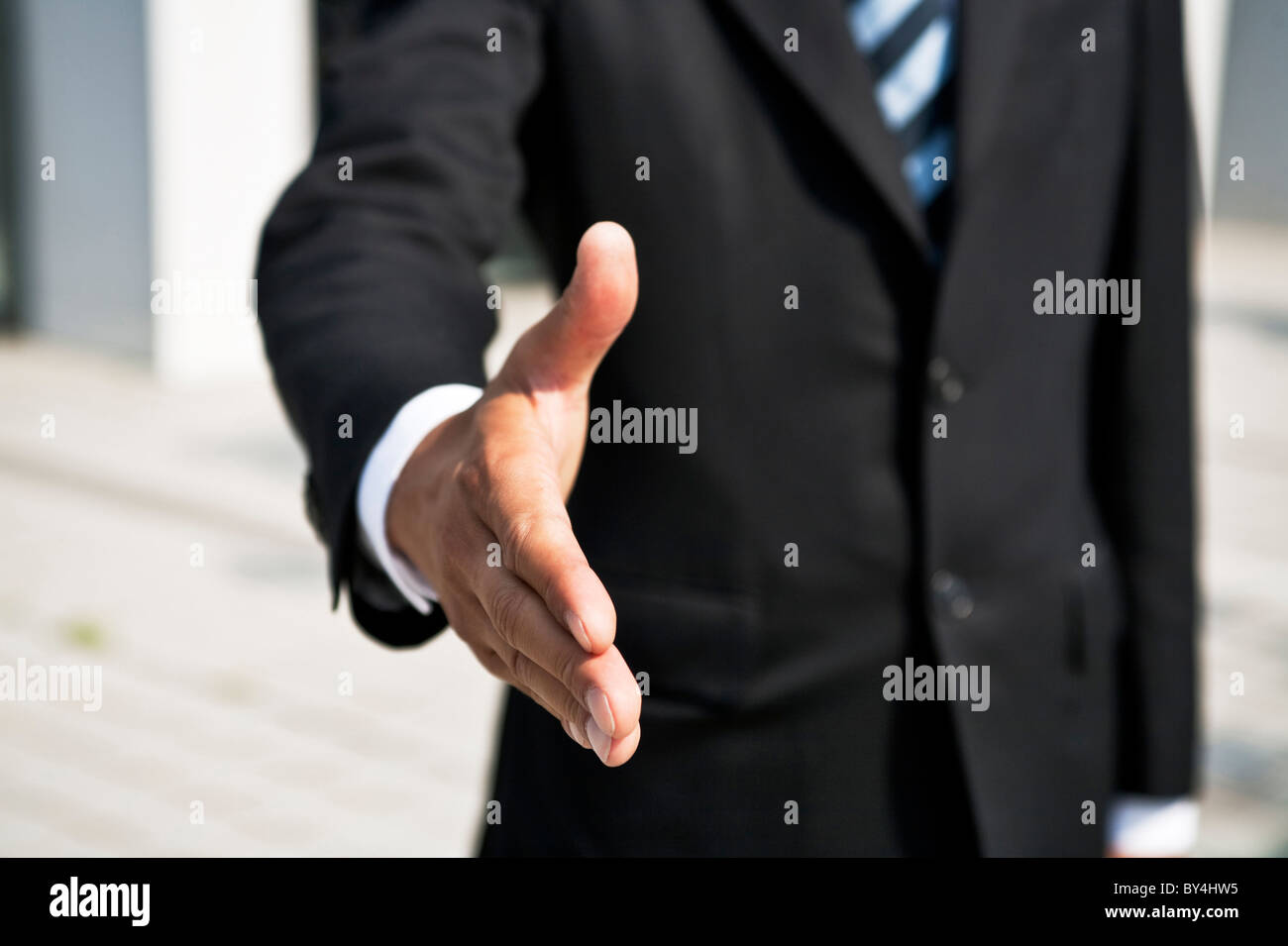 Businessman ready for handshake Stock Photo - Alamy