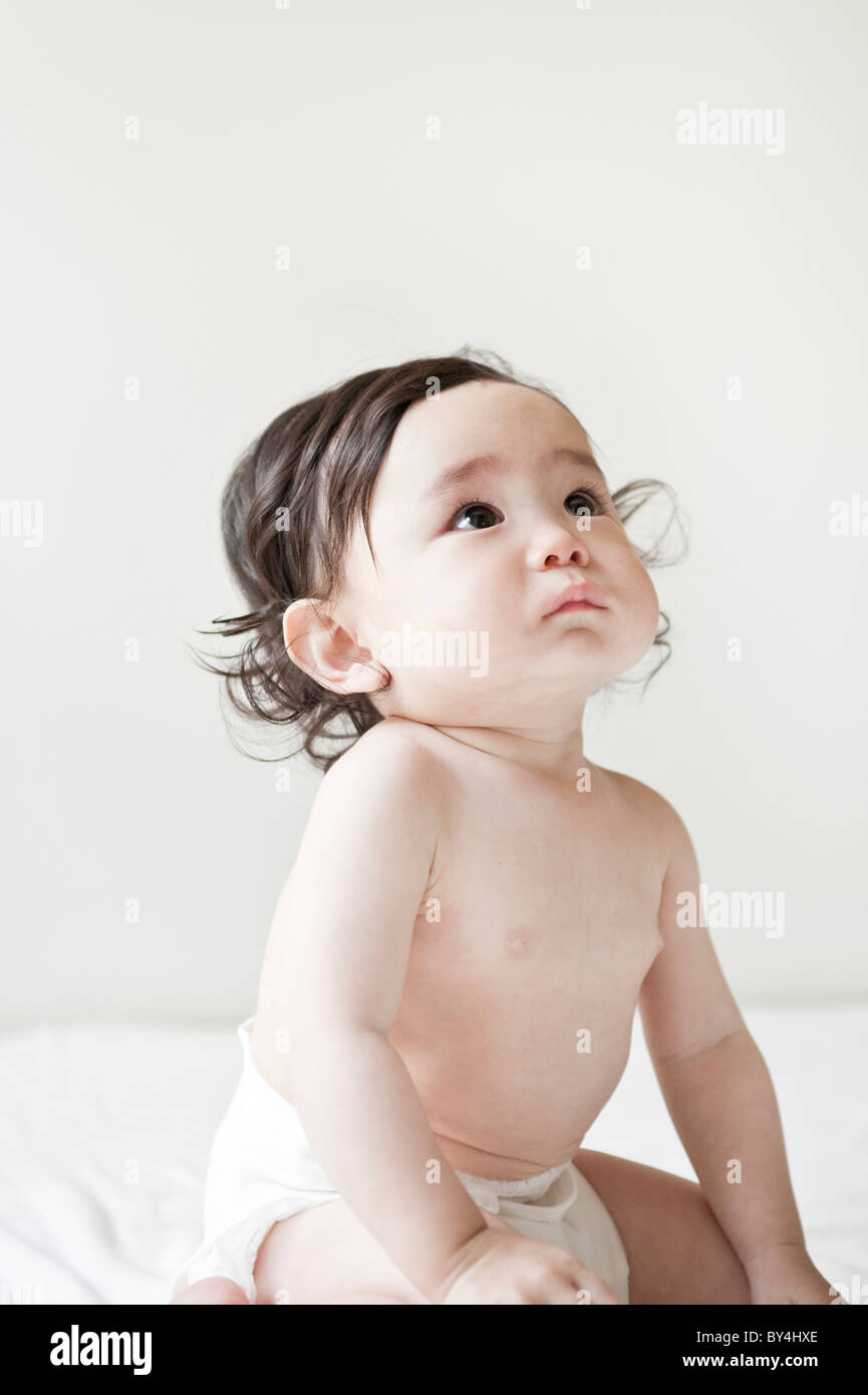 Baby looking up Stock Photo - Alamy
