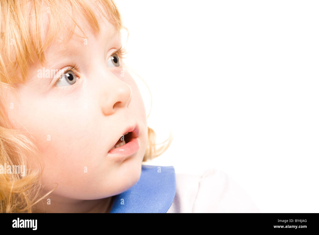 Close-up of small girl’s face from aside looking forward Stock Photo ...