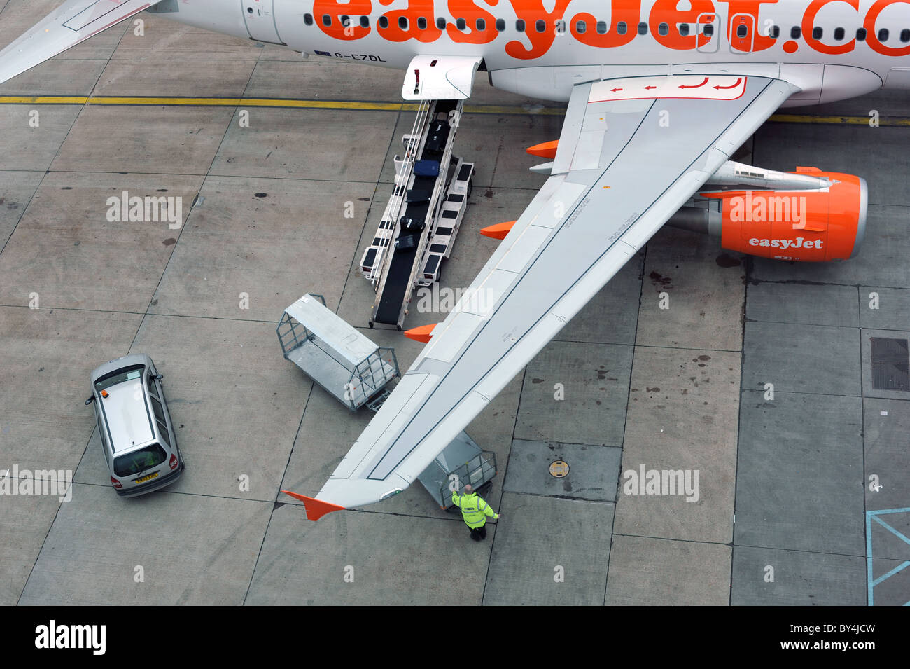 Airside baggage handling at Gatwick airport, UK Stock Photo - Alamy