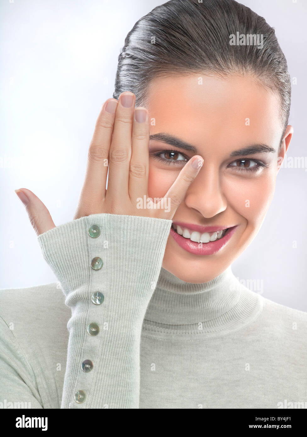 Young woman showing fingers Stock Photo - Alamy