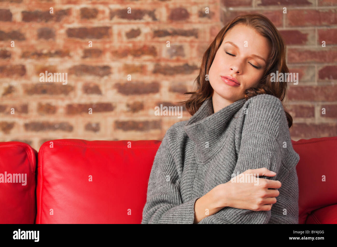 Young woman resting with eyes closed Stock Photo - Alamy