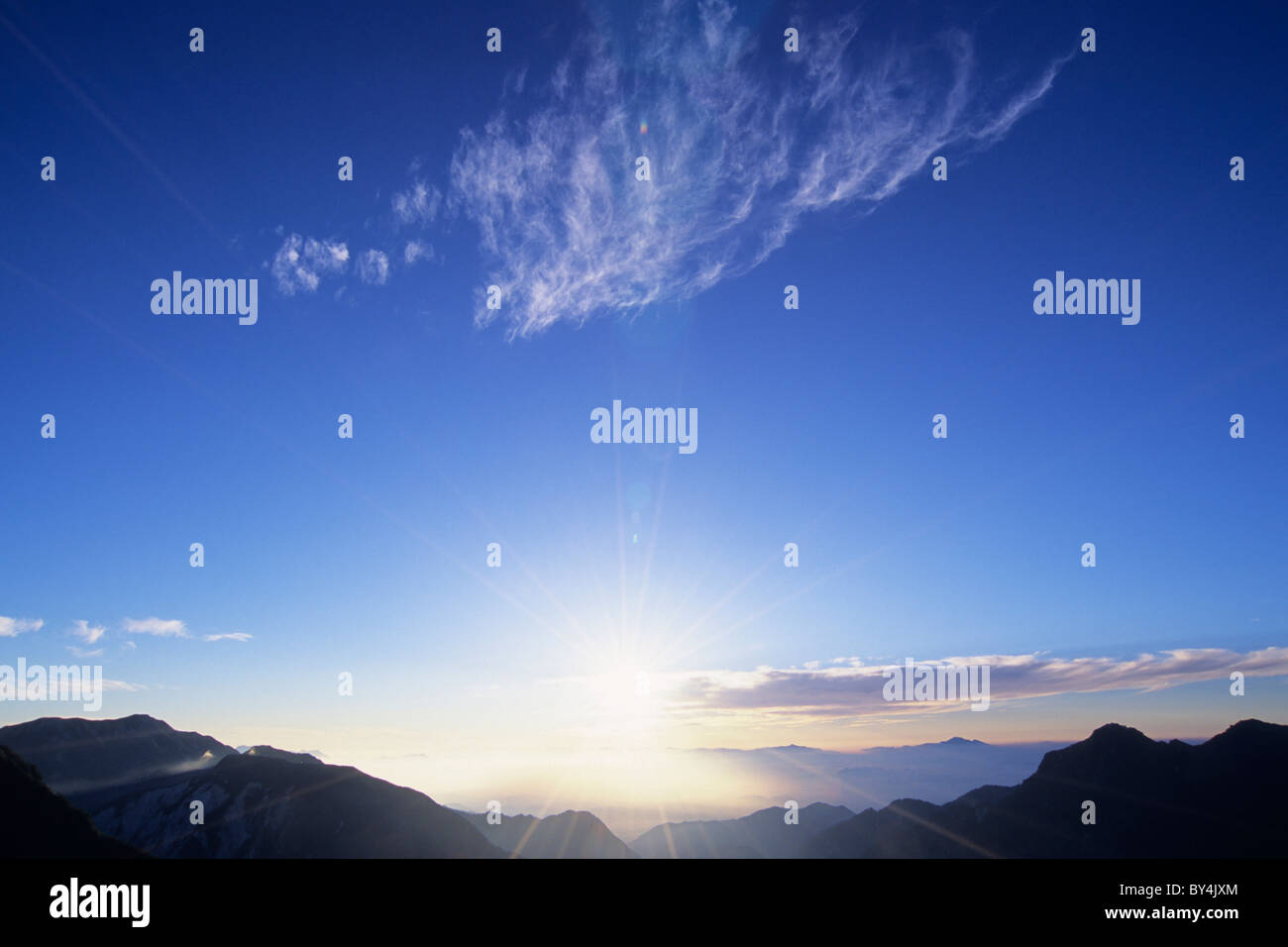 Sun Over Mountains Stock Photo - Alamy