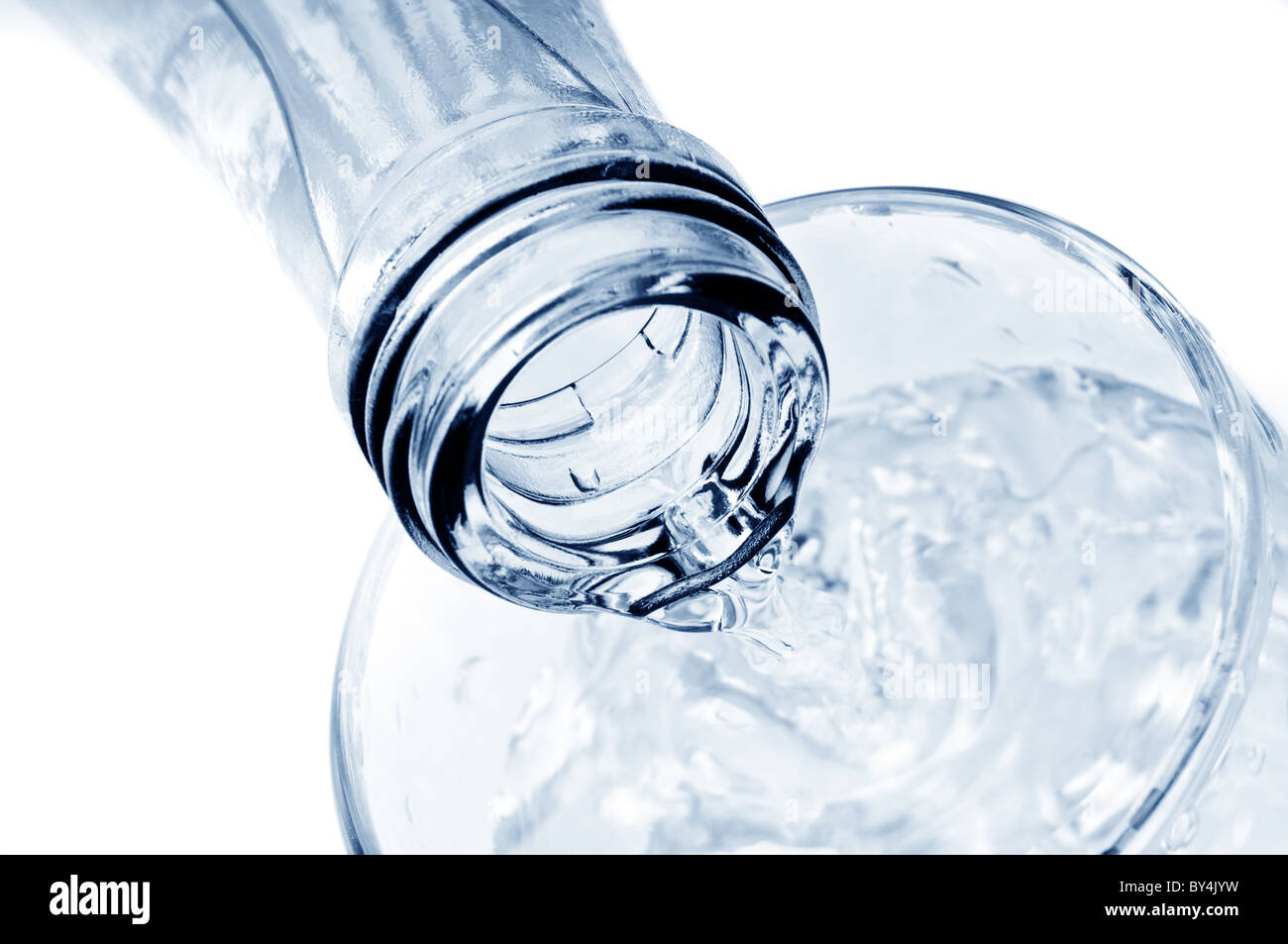 bottle pouring water into glass Stock Photo - Alamy