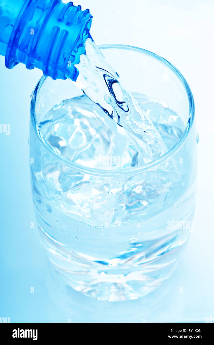bottle pouring water into glass Stock Photo - Alamy