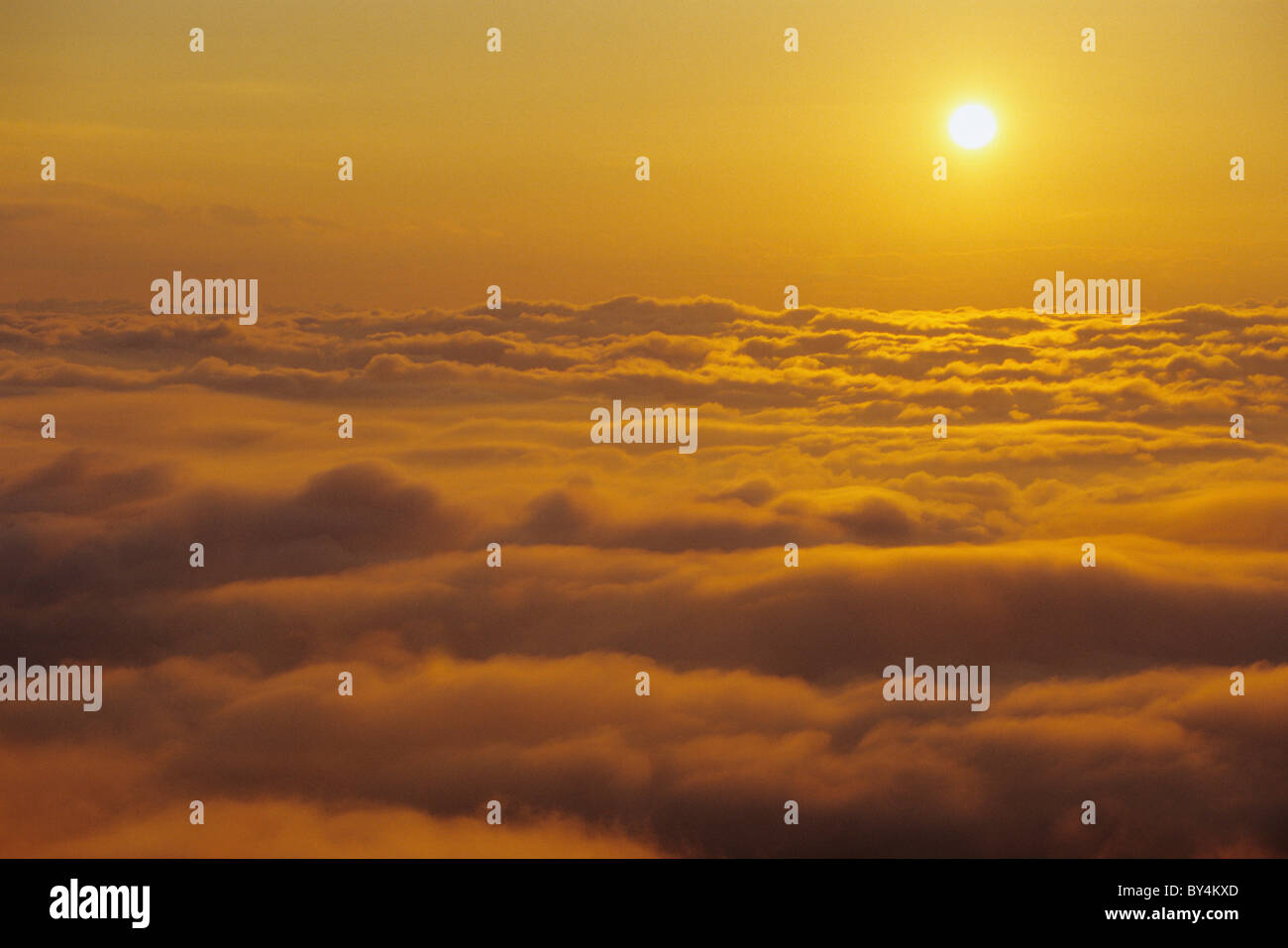 Sun Rising Above Clouds Stock Photo - Alamy