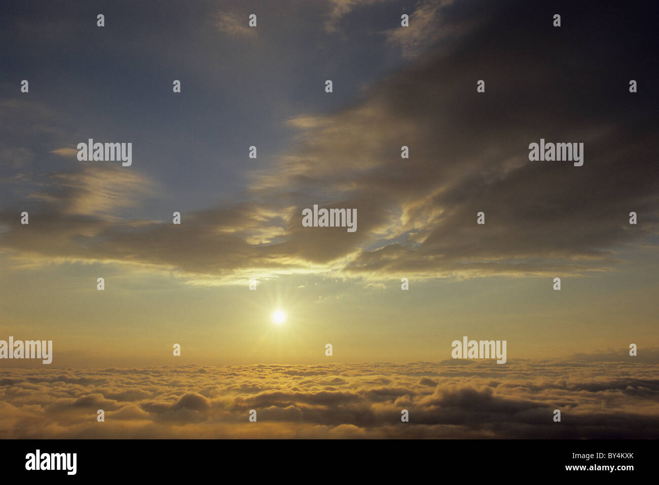 Sun Rising Above Clouds Stock Photo - Alamy