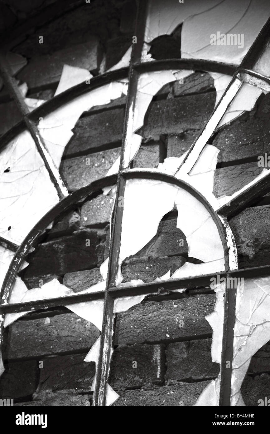 An old window broken and smashed by vandals Stock Photo - Alamy