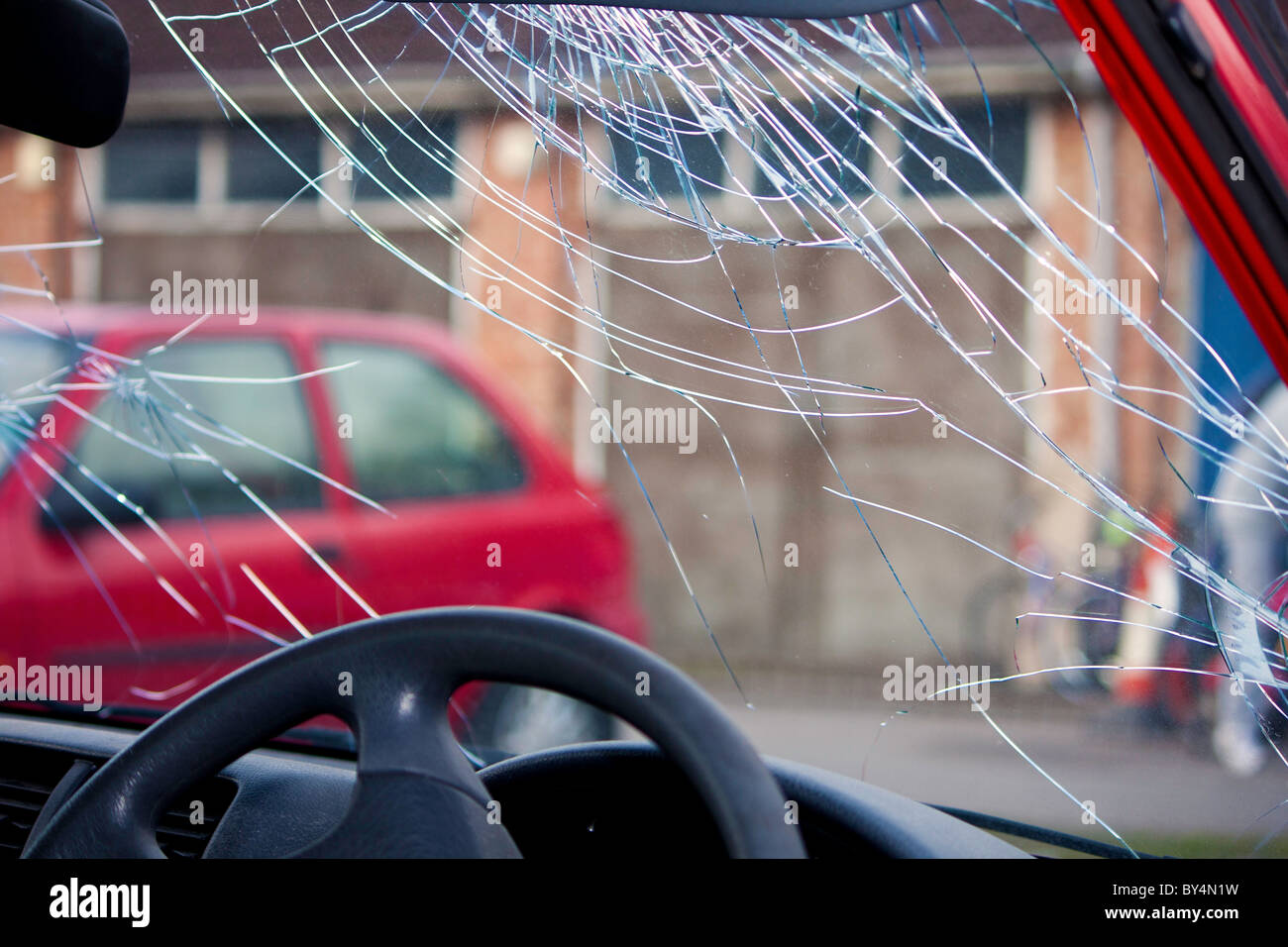 car accident where the window has smashed and caused damage Stock Photo ...