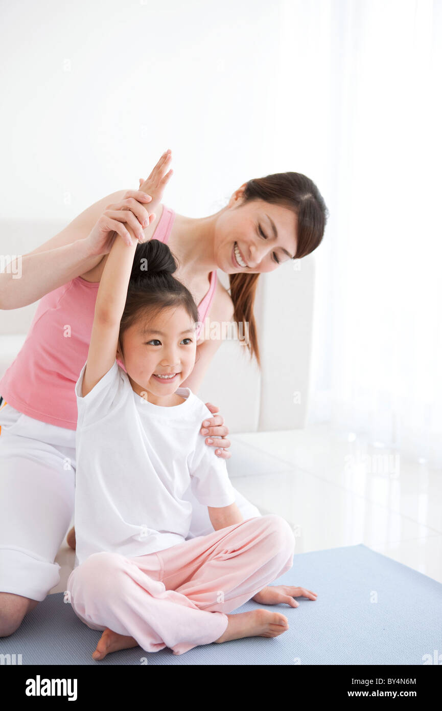 Mother guiding daughter in hi-res stock photography and images - Alamy