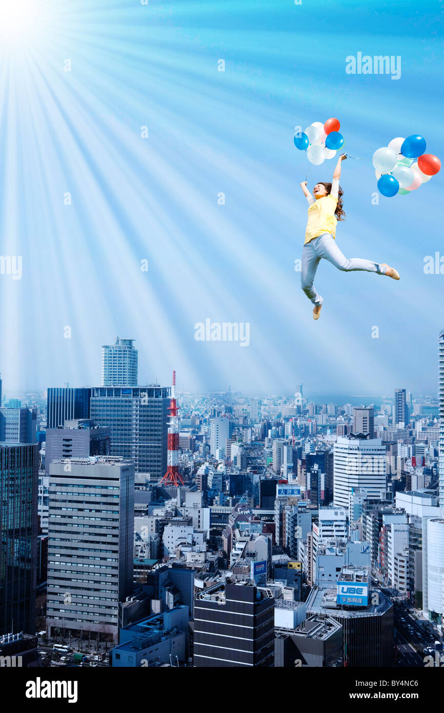 Young Woman Flying Above City Stock Photo - Alamy
