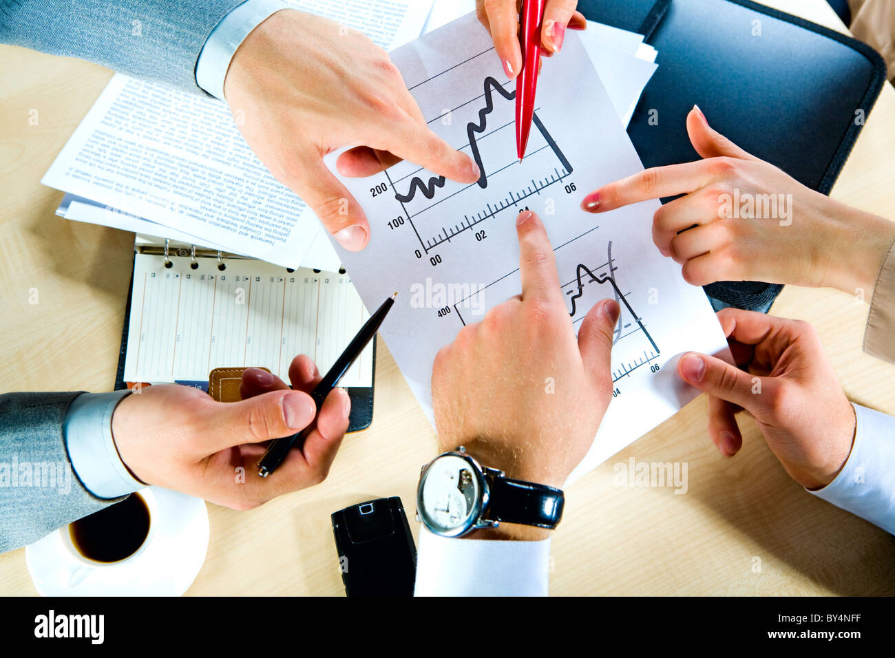 Image of hands showing the document at workplace Stock Photo - Alamy