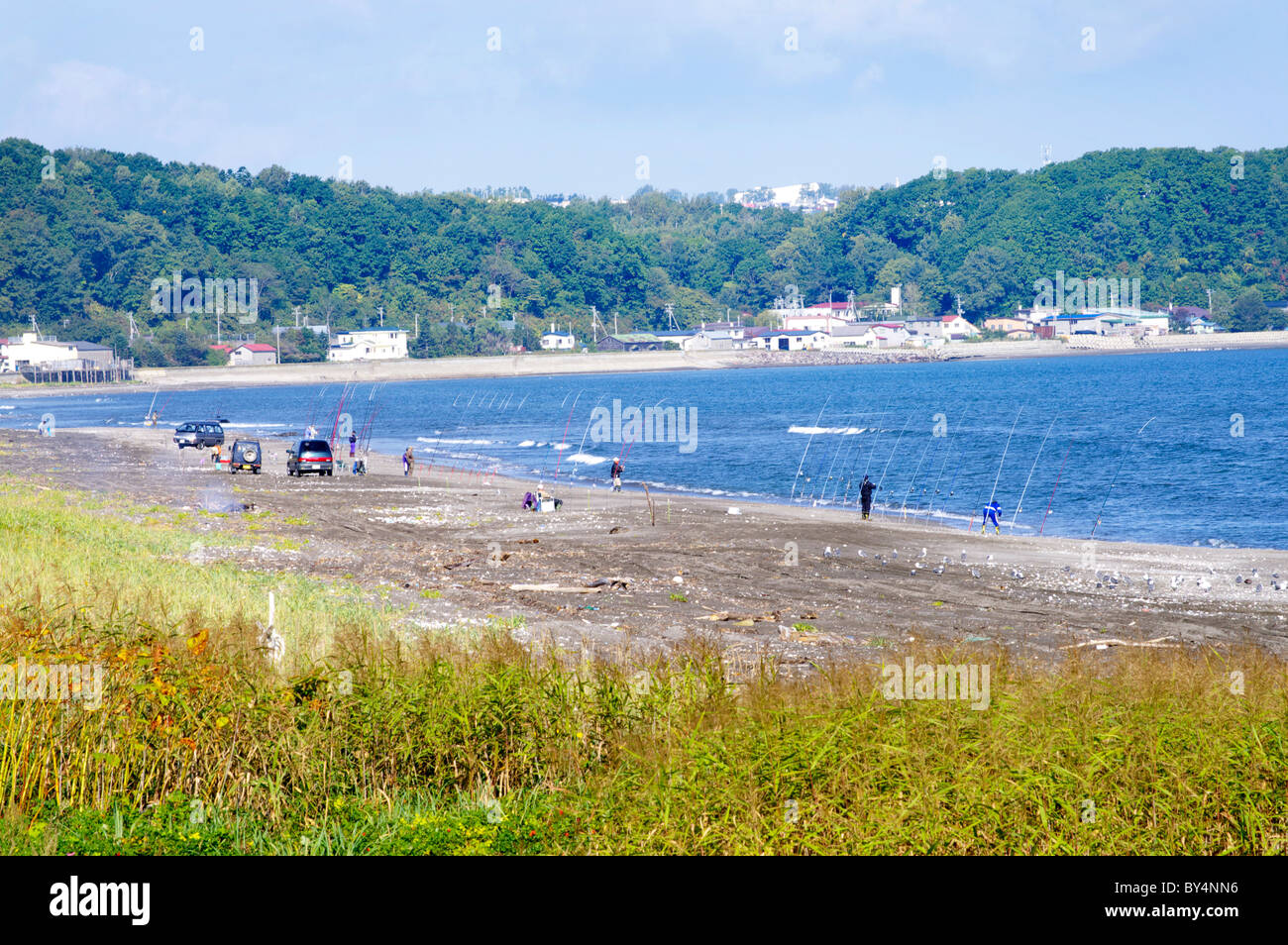 Fishing on Beach Stock Photo - Alamy