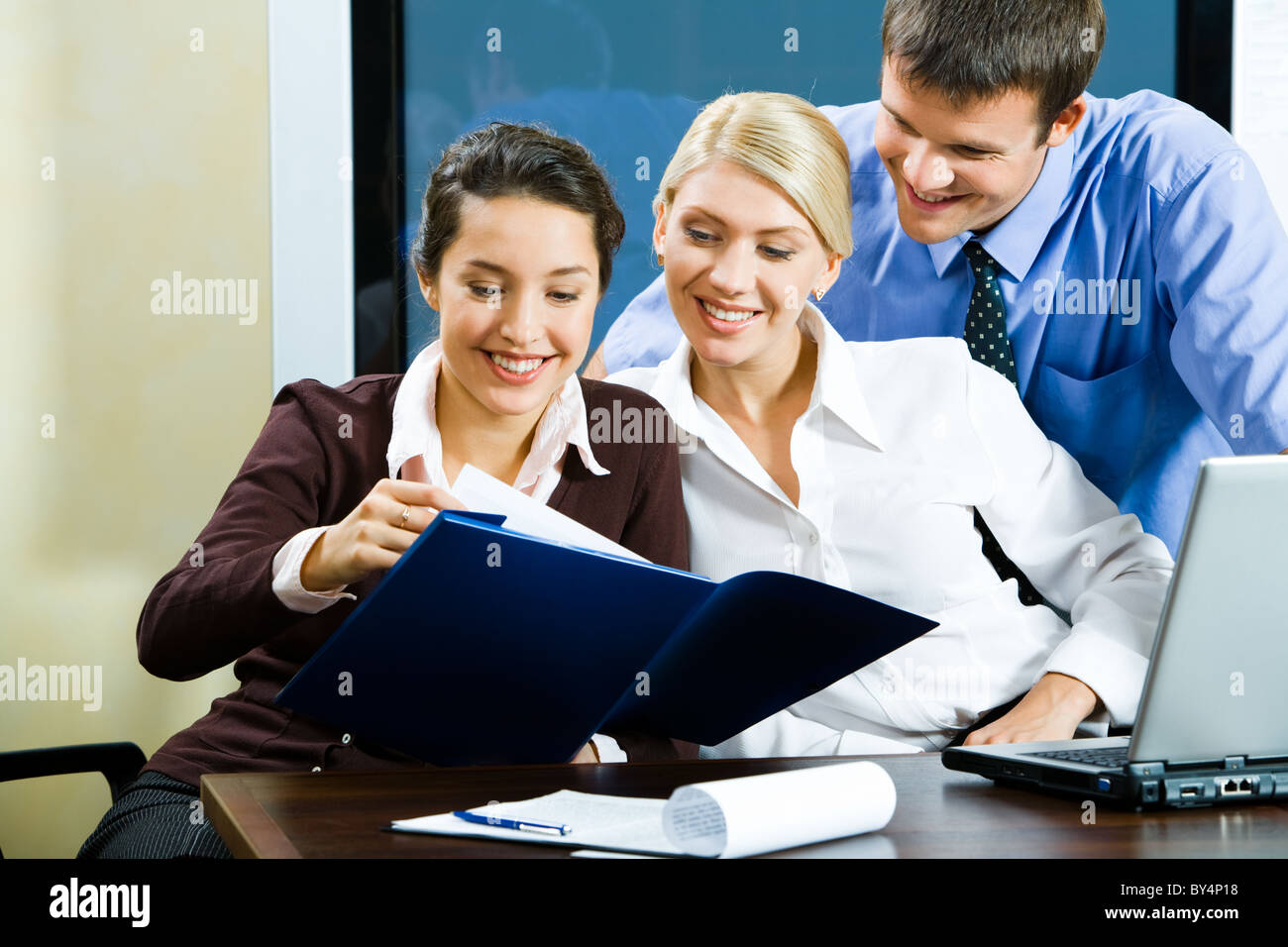 Group of three business people working together in the office Stock ...