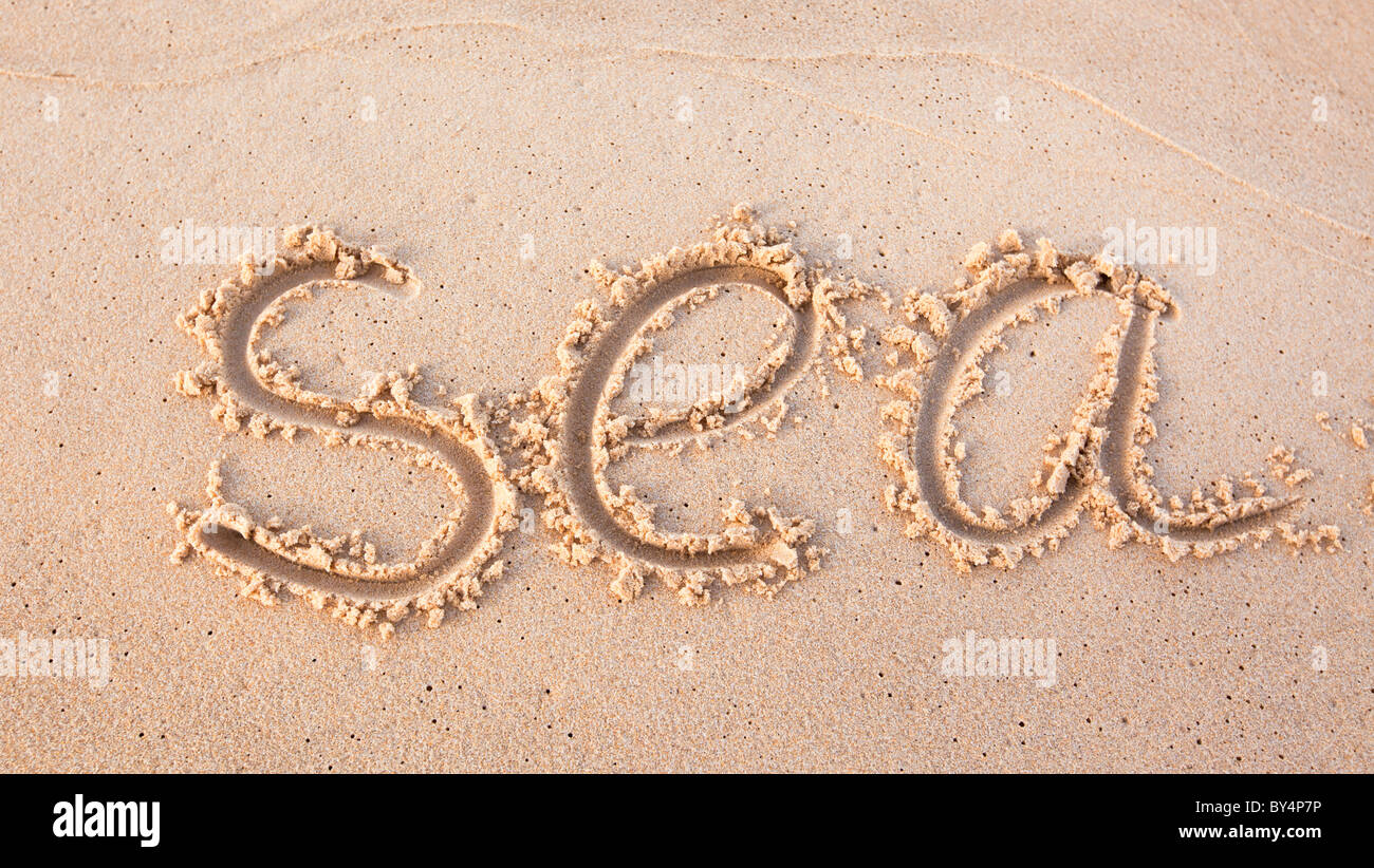 word "sea" written on beach sand. horizontal shot Stock Photo - Alamy