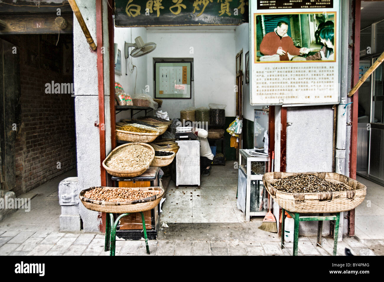 CHINA, XIAN: Tiny storefront shop selling seeds and nuts in the Muslim ...