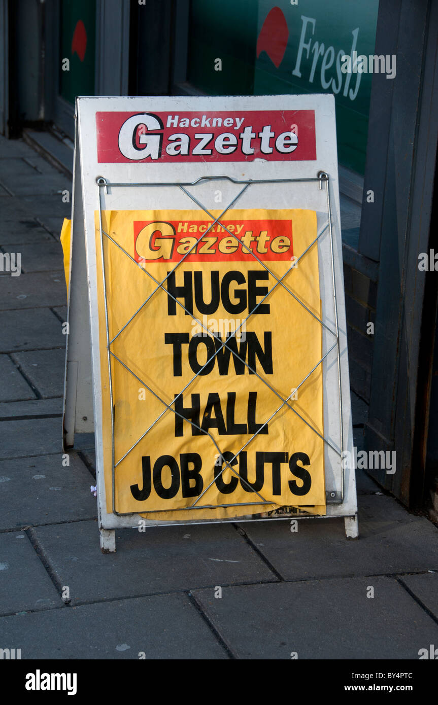 Newspaper placard saying Huge Town Hall Job Cuts Stock Photo - Alamy