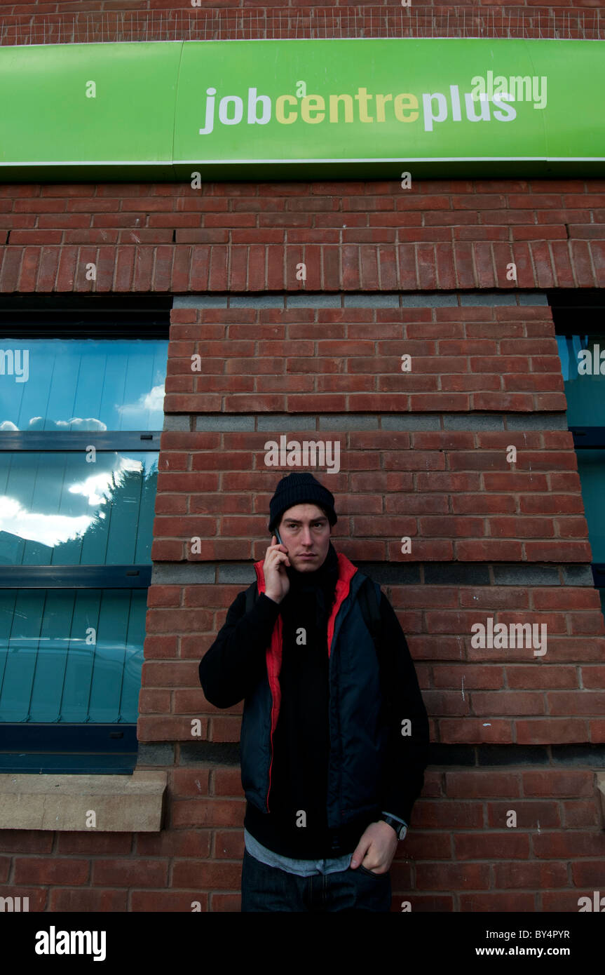 Hackney economic crisis.Young man looking for work outside job centre ...