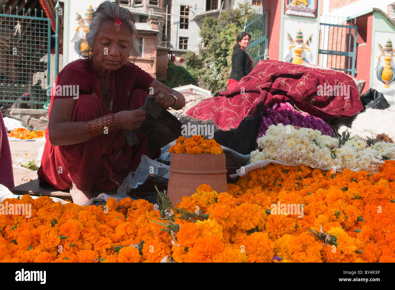 marigold seller at Pashupatinath Temple in Kathmandu, Nepal Stock Photo ...
